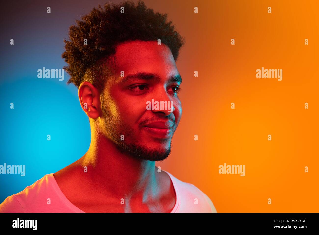 Portrait of a young african man at studio. Fashion male model in ...