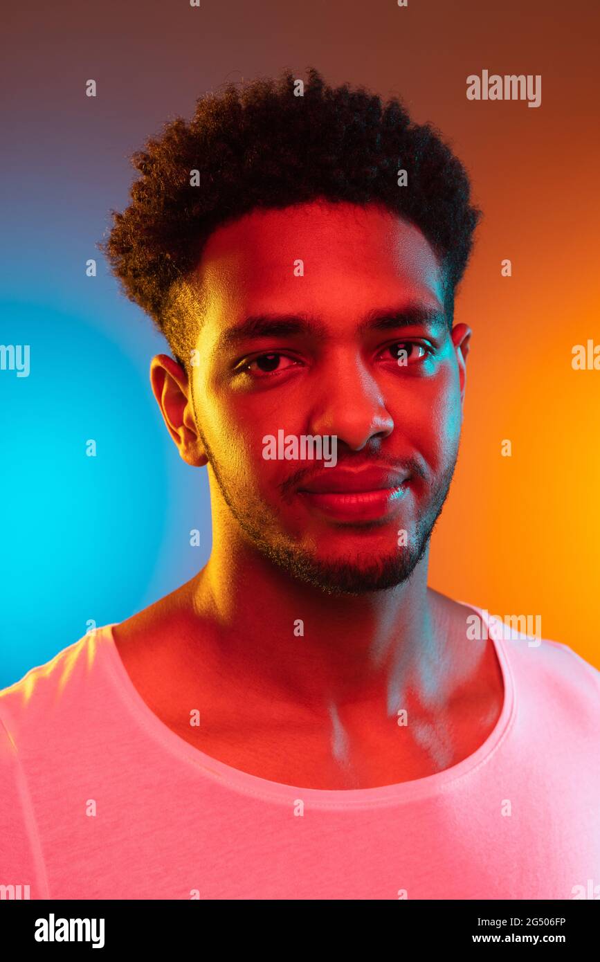 Portrait of a young african man at studio. Fashion male model in ...