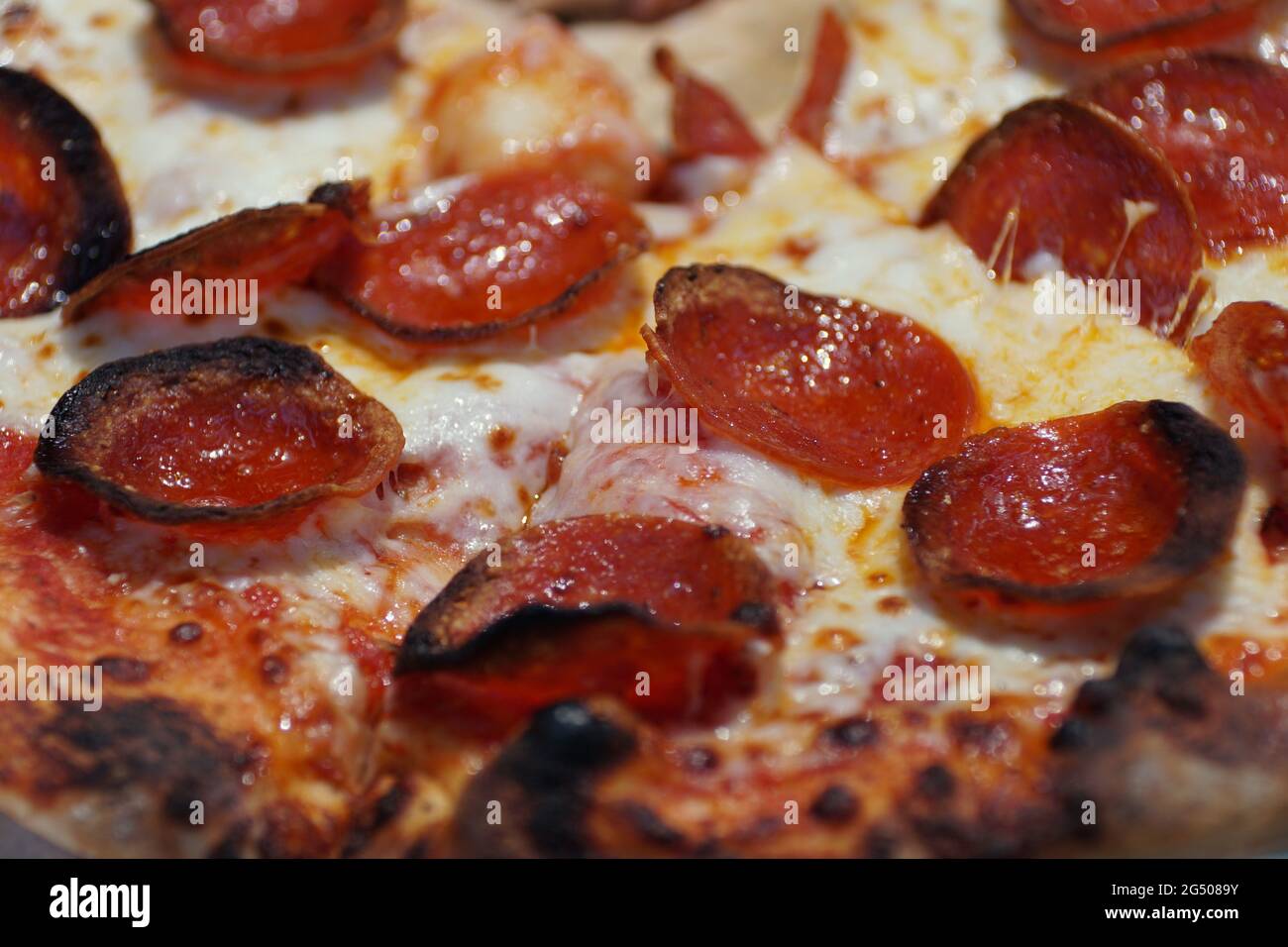Close up of a crusty pepperoni and cheese pizza Stock Photo - Alamy