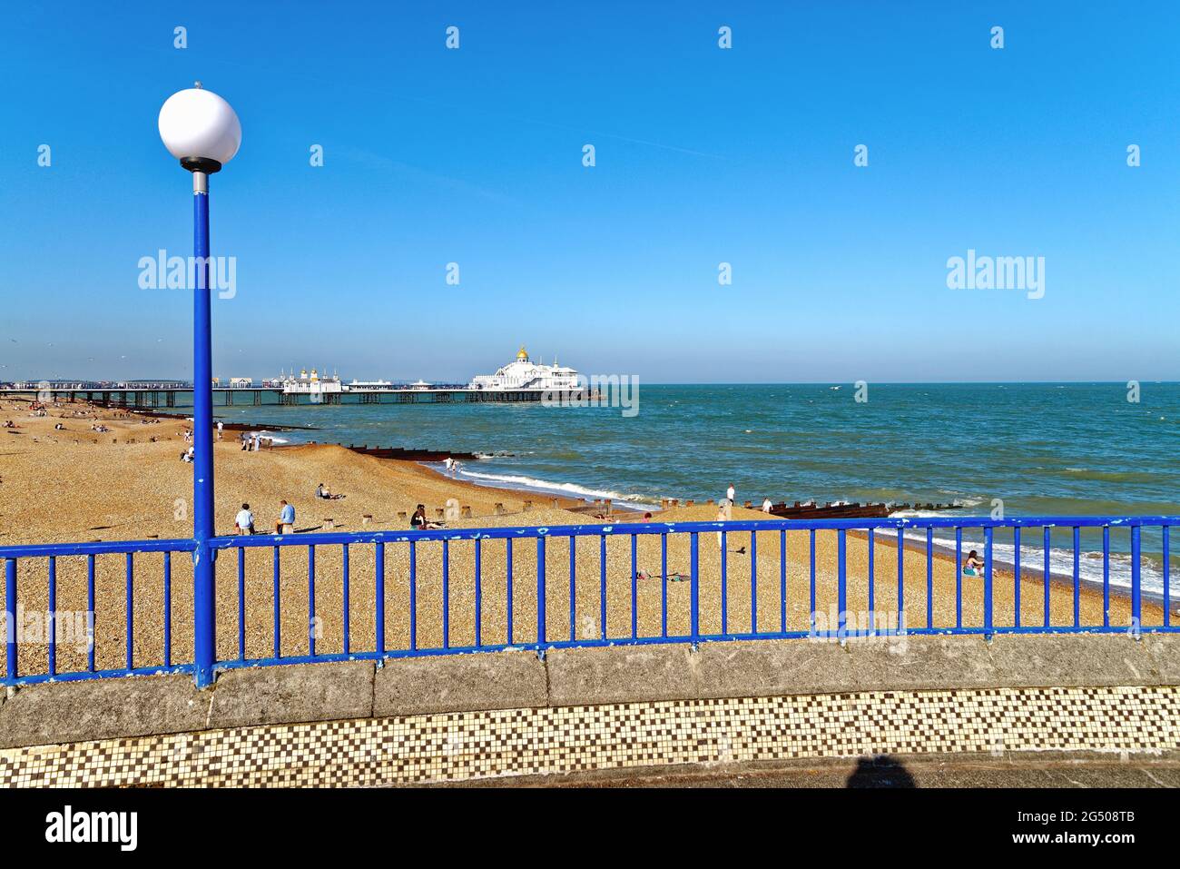Eastbourne seafront pier and beach on a sunny summers evening, East ...