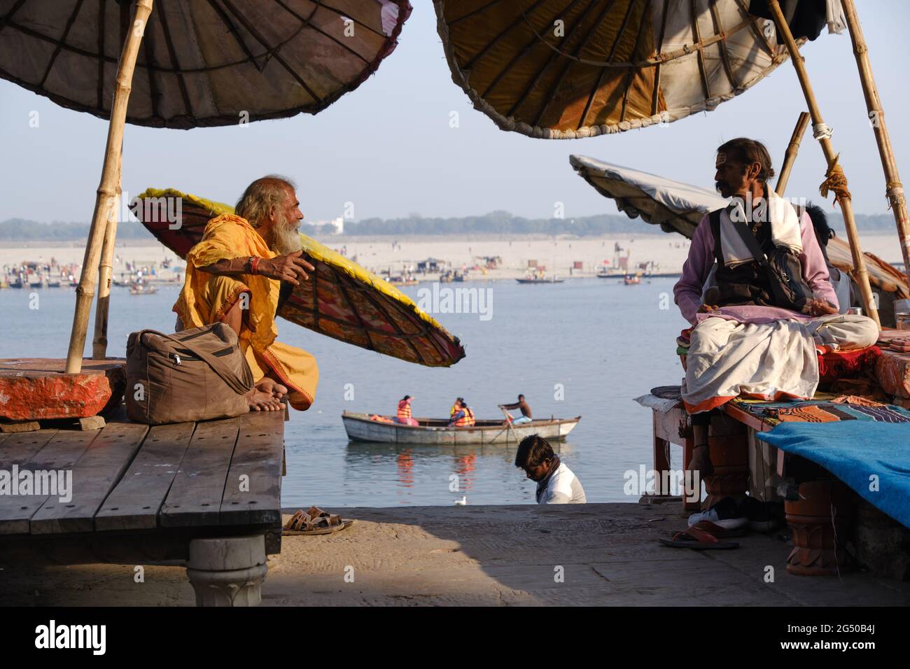 Varanasi Ghat, Uttar Pradesh, India, Feb 03, 2021, An old pandit sits ...