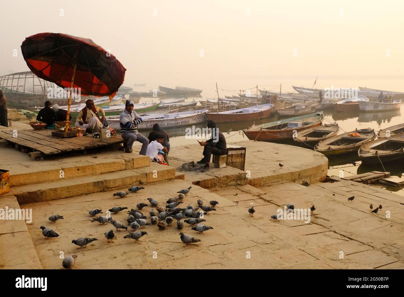 Varanasi Ghat, Uttar Pradesh, India, Feb 03, 2021, An old pandit sits ...