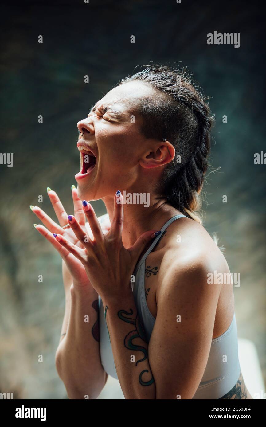 Portrait crying hipster woman standing hi-res stock photography and ...