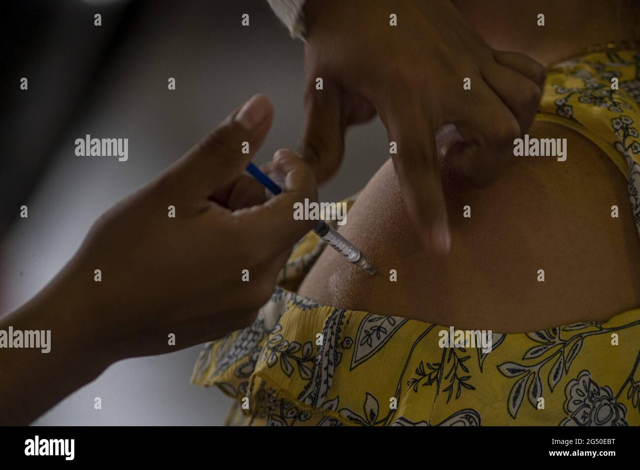 A person receives an AstraZeneca dose to immunized against Sars Cov-2 ...