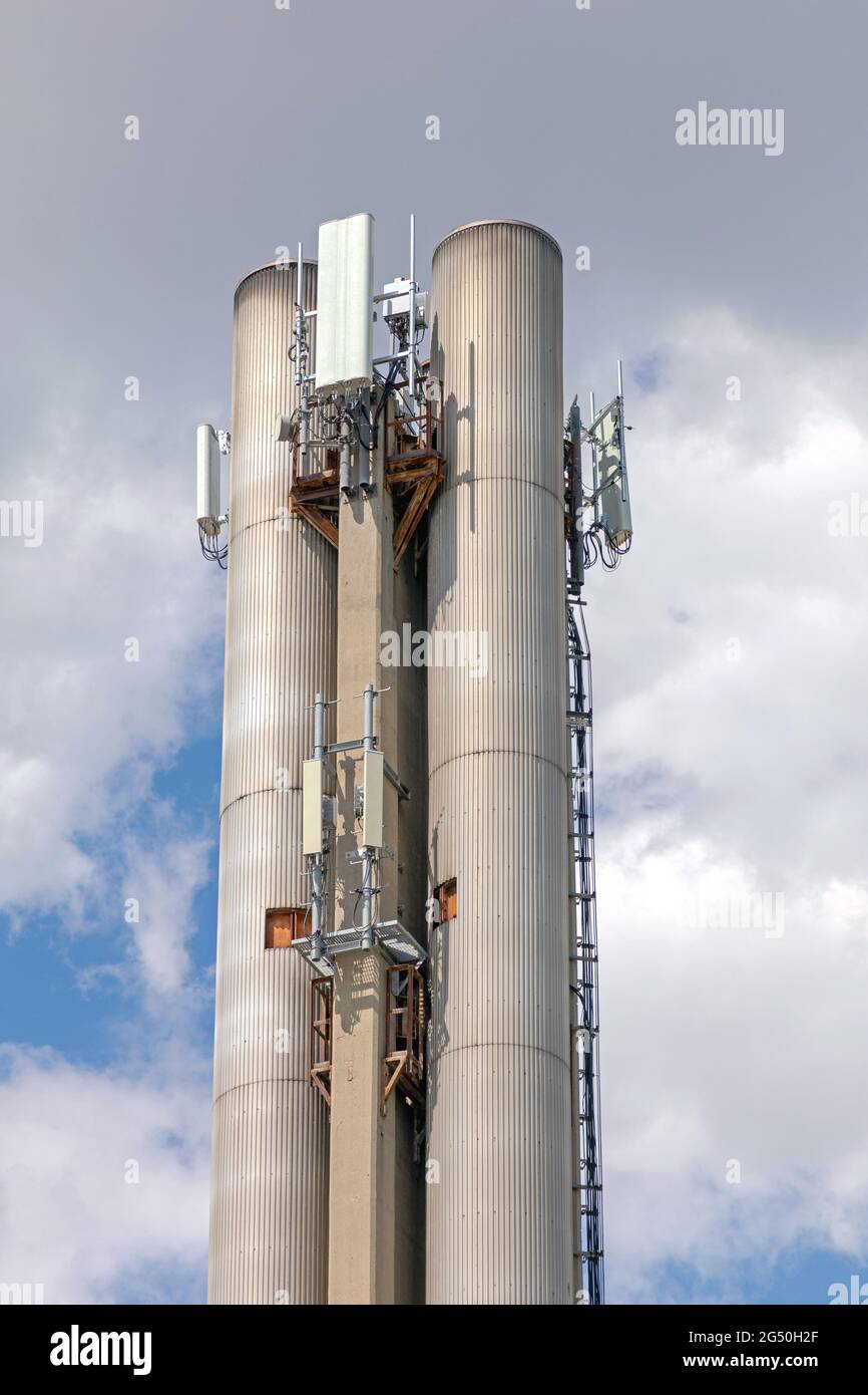 Industrial Chimneys at Power Plant With Cellular Antennas Stock Photo ...