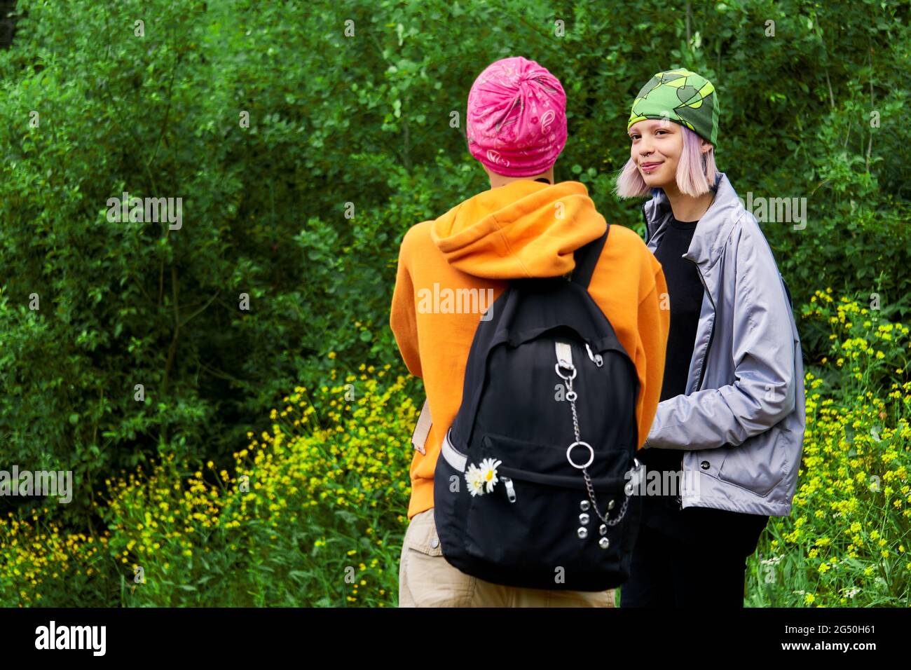 Teenagers chatting grass hi-res stock photography and images - Alamy