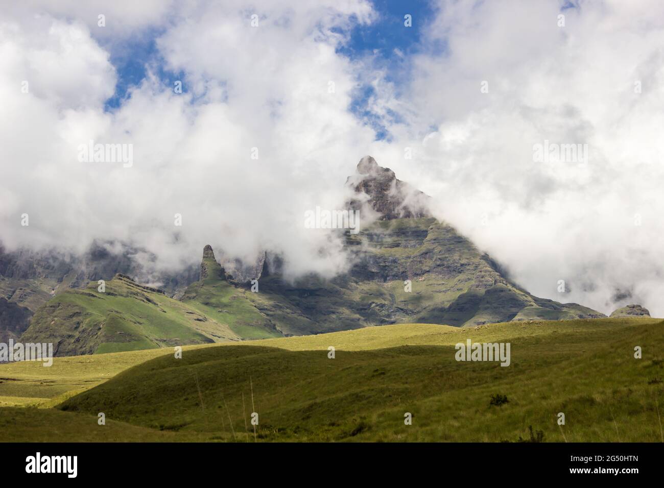 Thick clouds gathering around the jagged basalt peaks of the ...