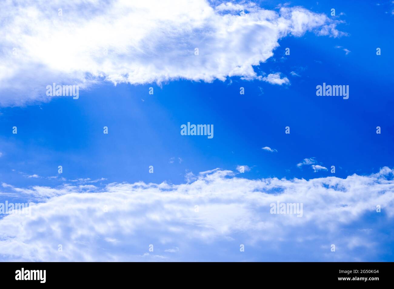 Sunny blue sky with white clouds Stock Photo - Alamy