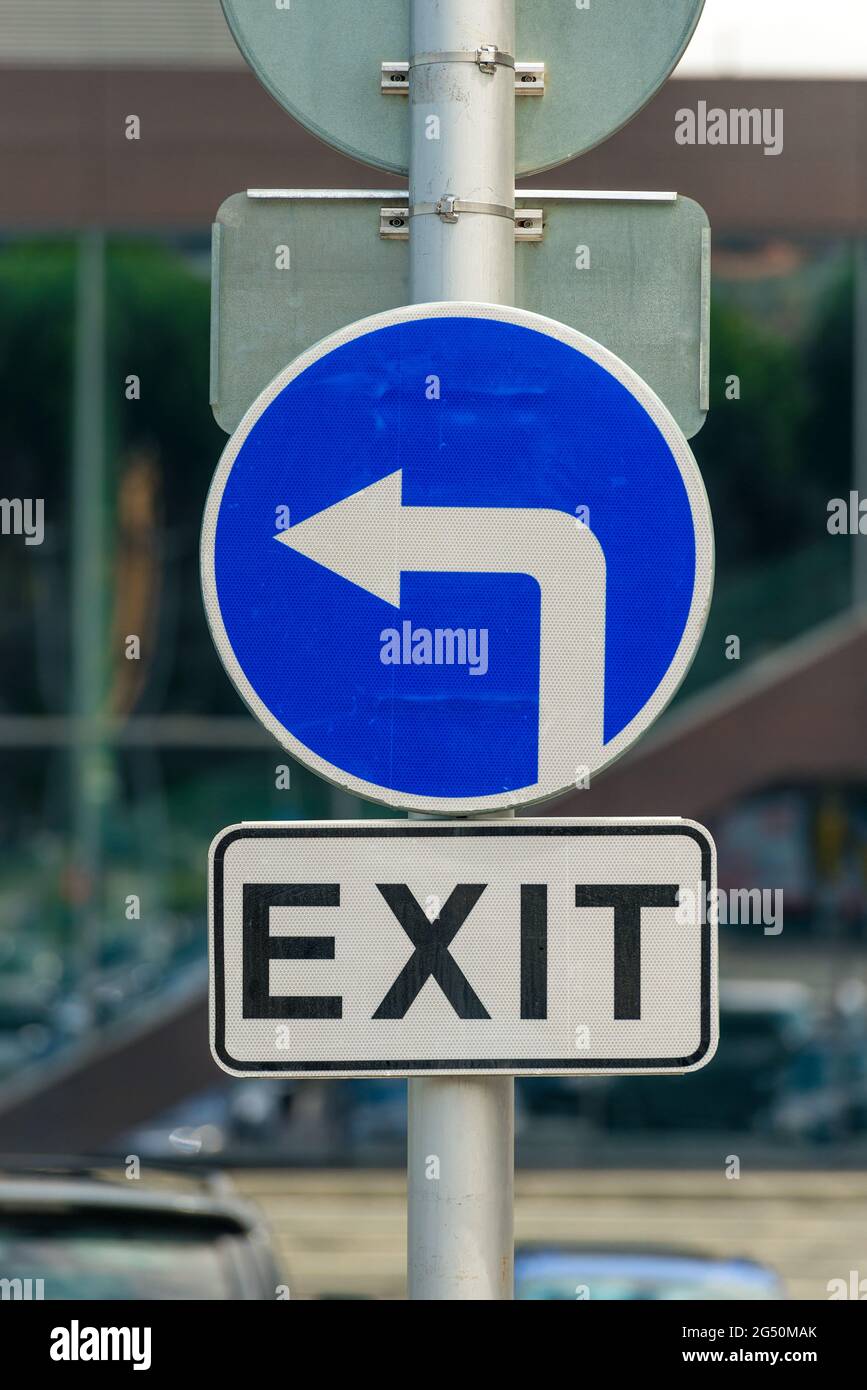 Arrow road sign left with EXIT Stock Photo - Alamy