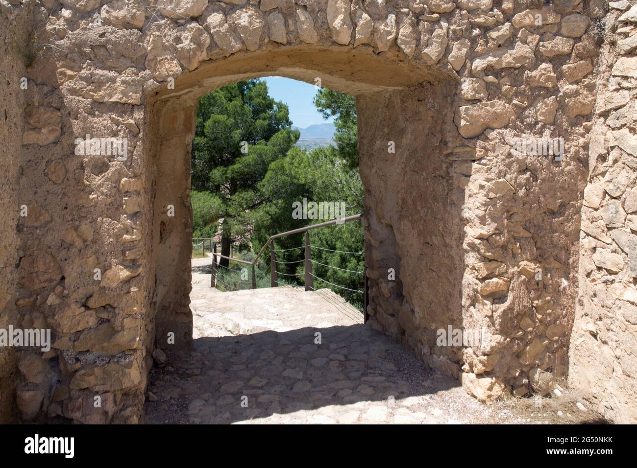 Exit arch of the stone wall of a medieval castle, towards the stairs ...
