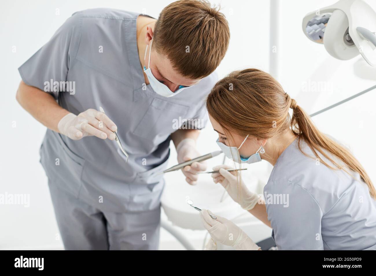 Hands dentists in mouth young hi-res stock photography and images - Alamy