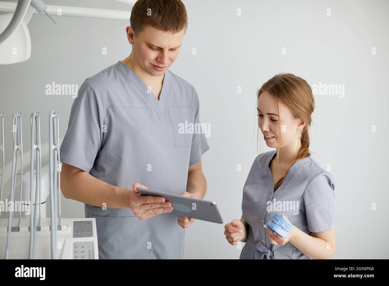 Group of cheerful healthcare workers working together at doctor's ...
