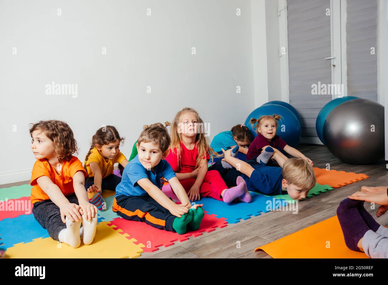 Children exercising while physical education lesson at preschool Stock ...