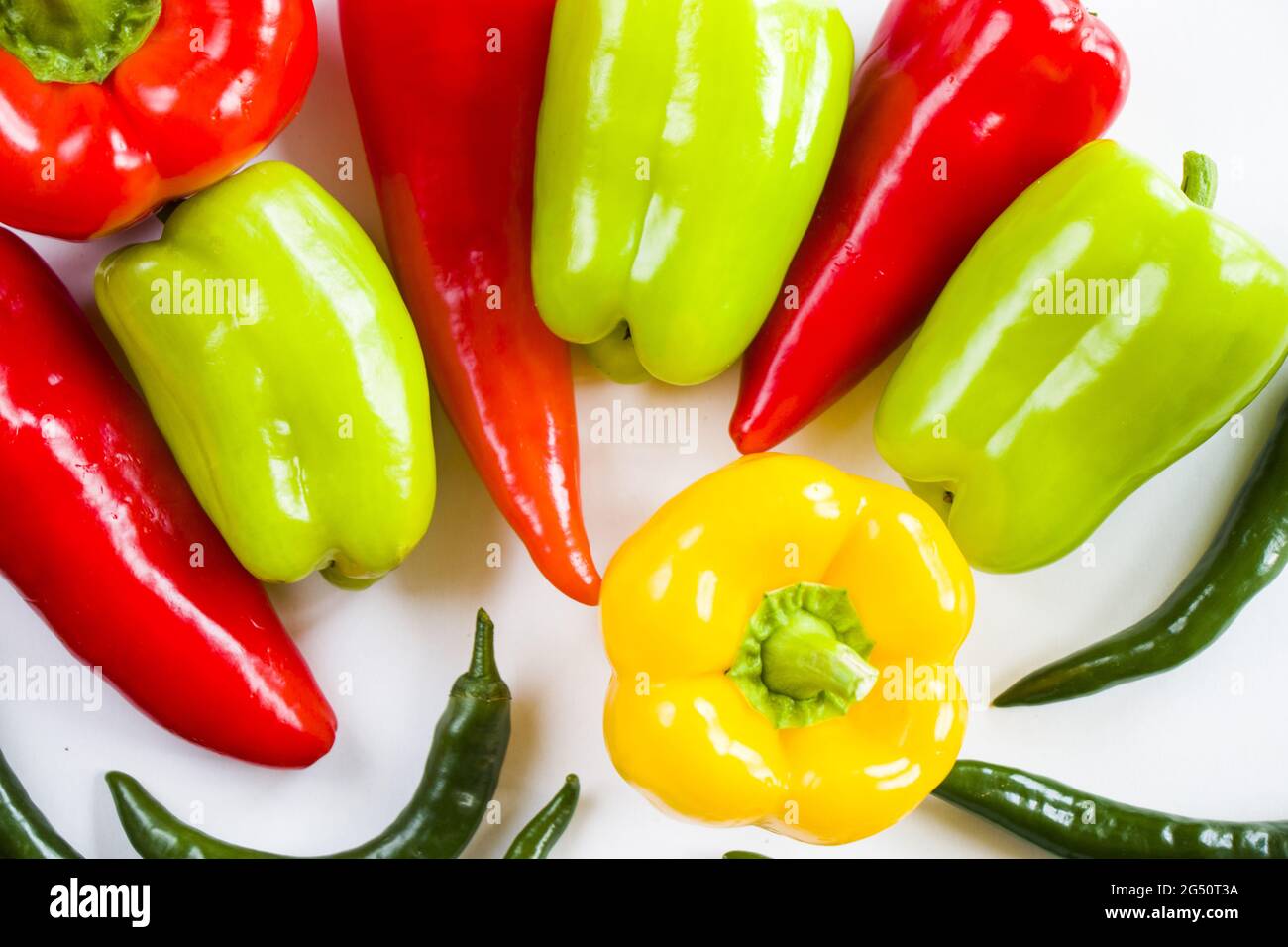 Top view of colorful bell and chili peppers isolated on white ...
