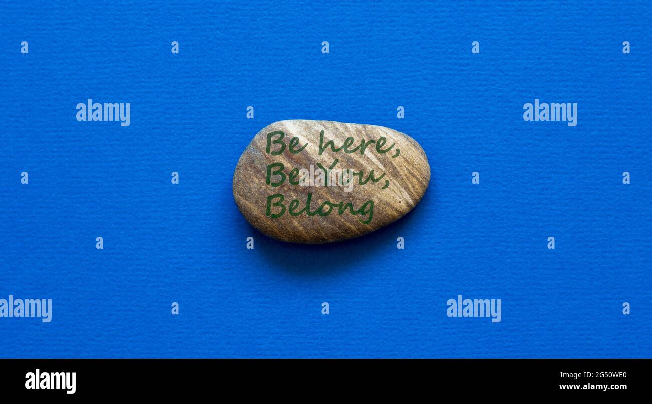 Be here, be you, belong symbol. Beautiful stone with words 'Be here, be ...