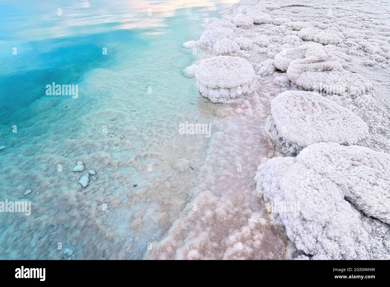 Sand completely covered with crystalline salt on shore of Dead Sea ...