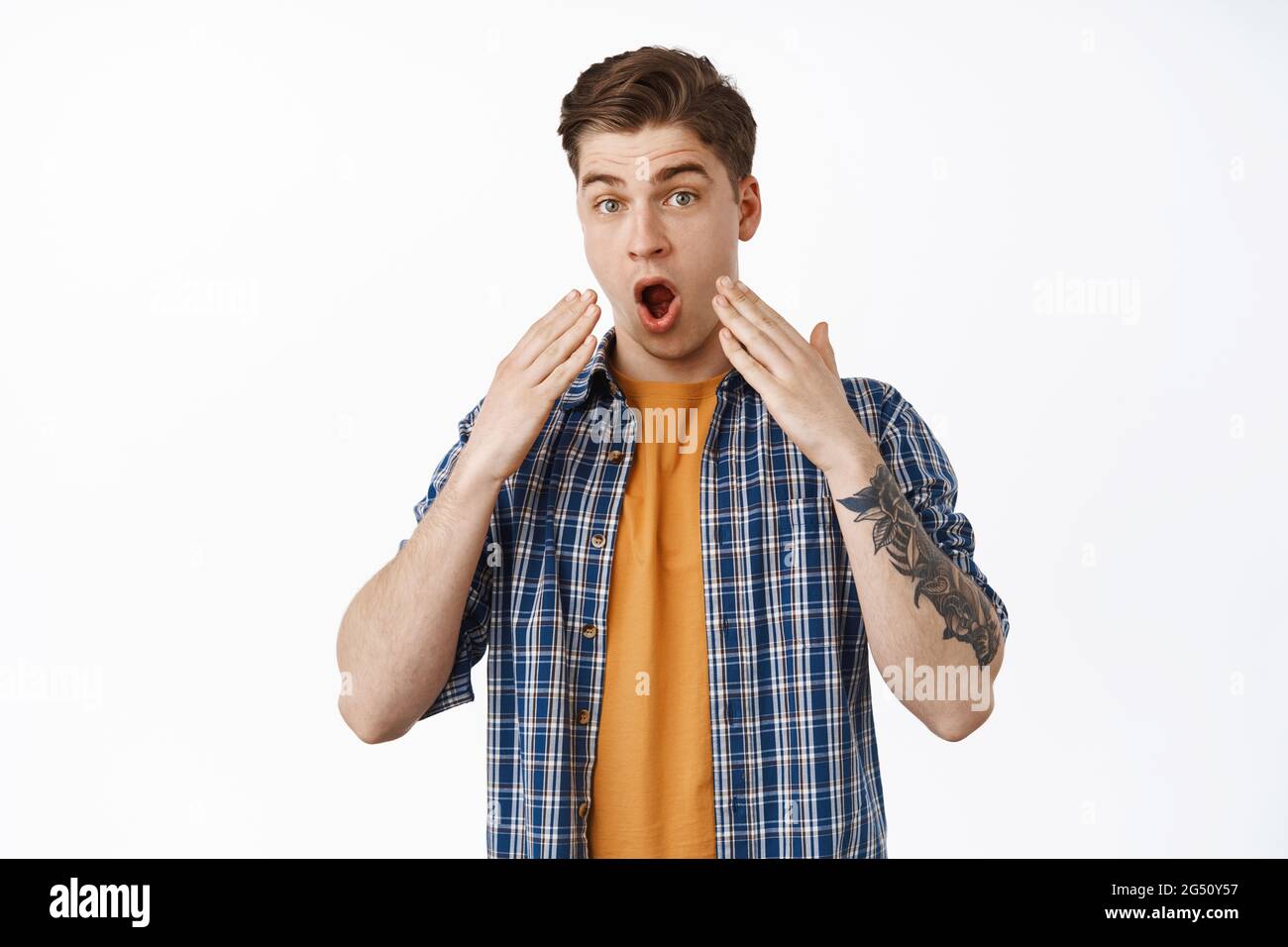 Image of shocked man drop jaw, say wow and stare startled, look in awe ...