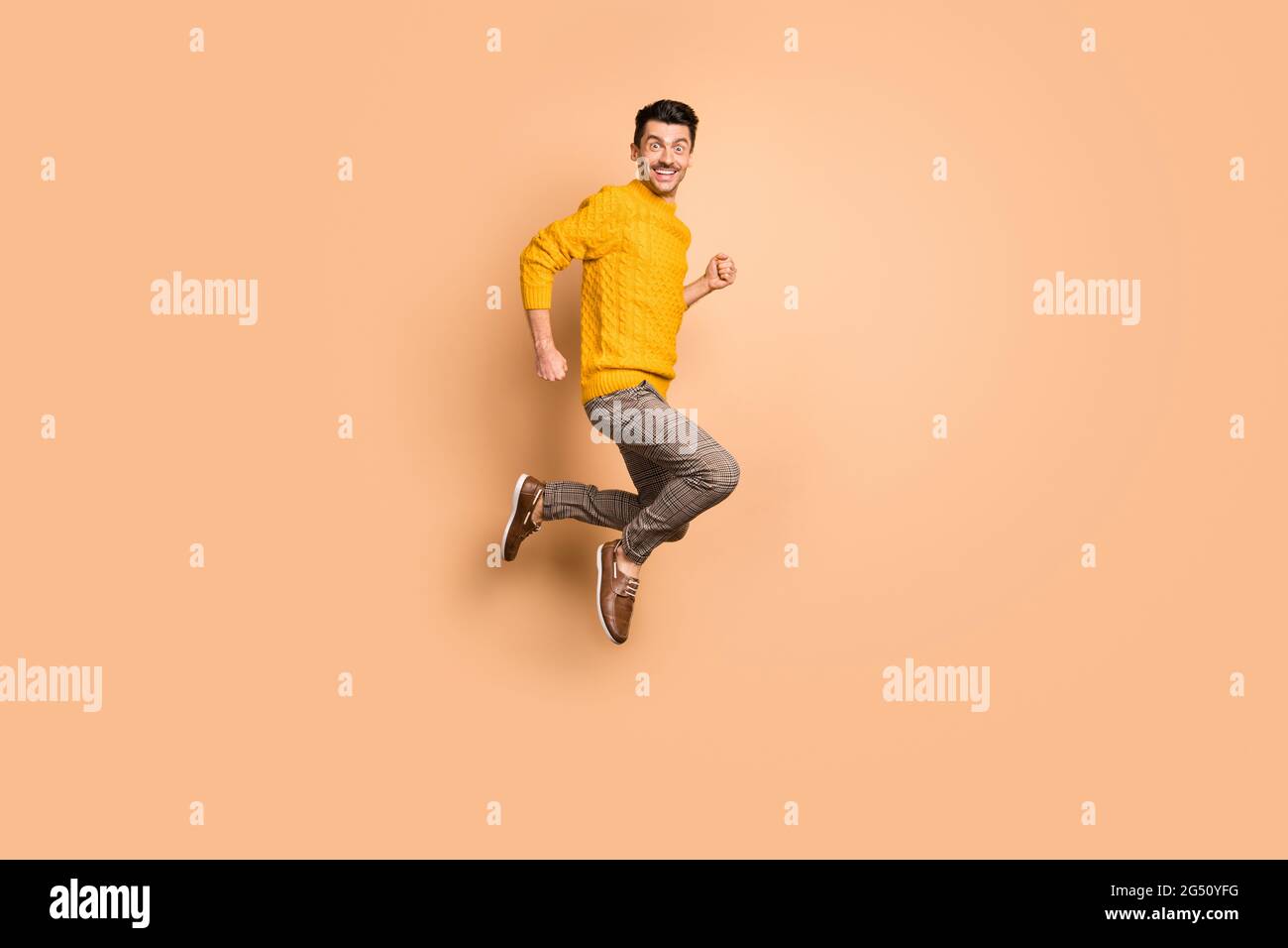 Full length photo portrait side profile of excited man jumping up ...