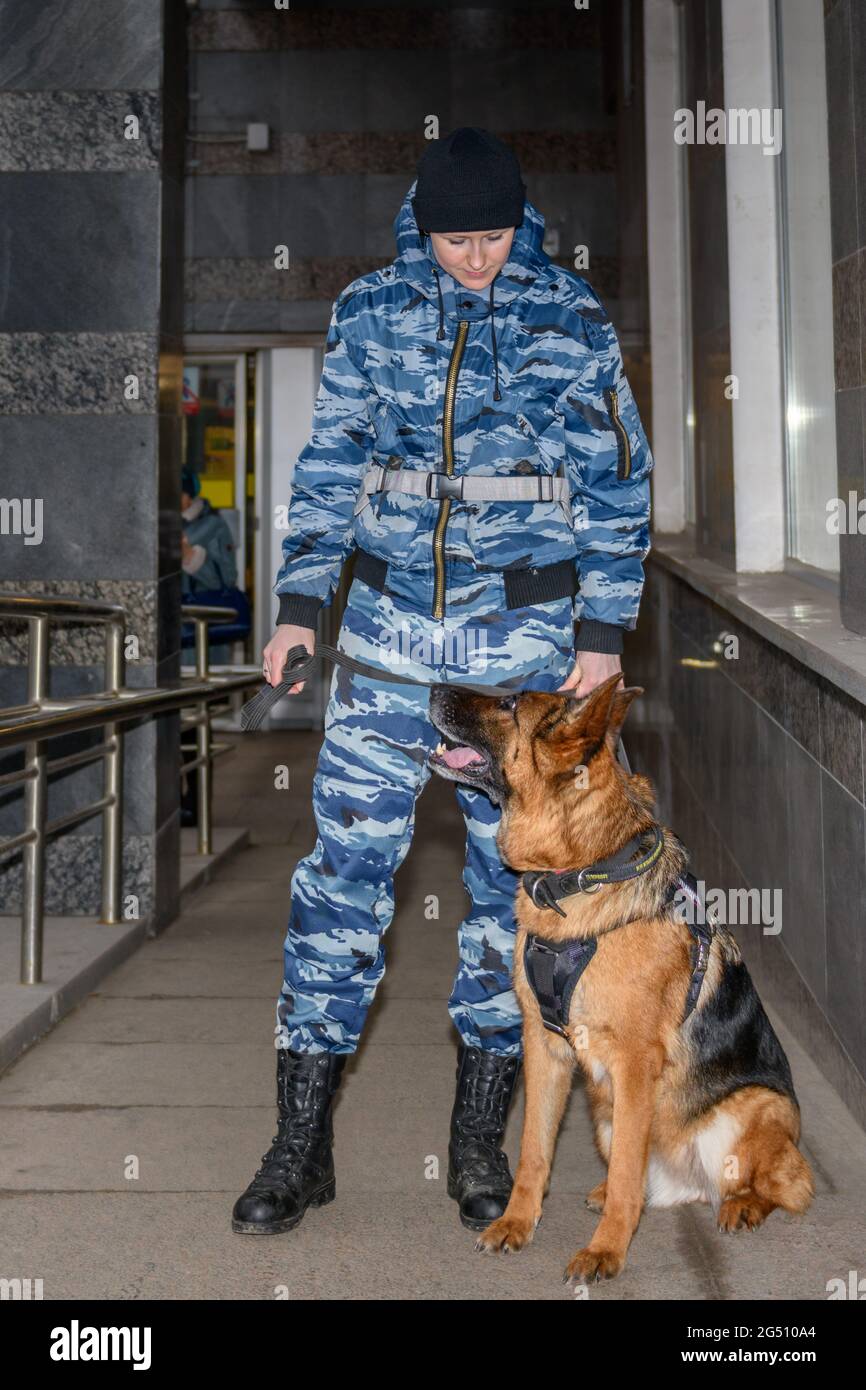 Female police officers with a trained dog. German shepherd police dog Stock Photo - Alamy