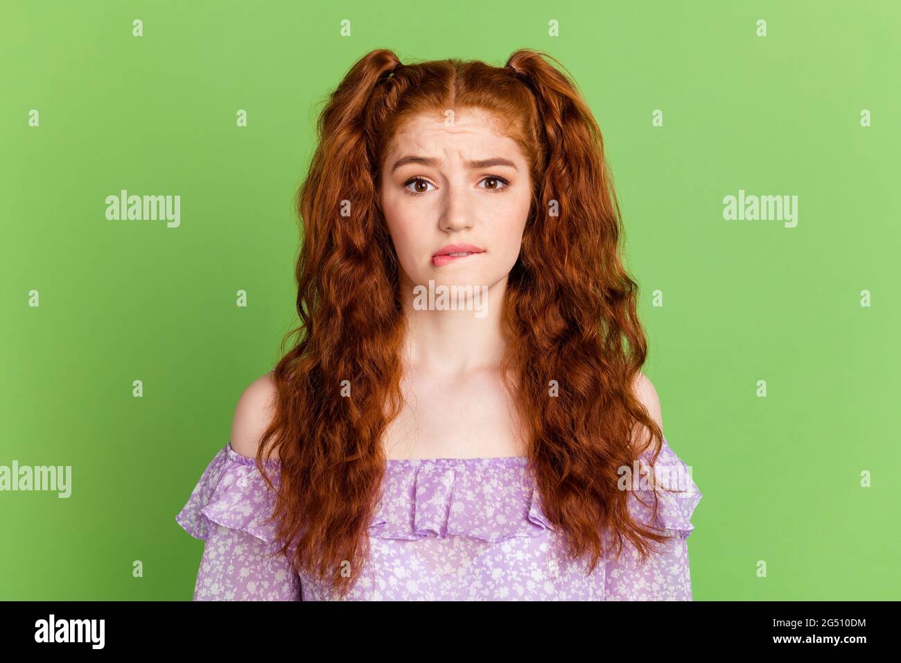 Photo of worried red hairstyle millennial lady bite lip wear violet ...