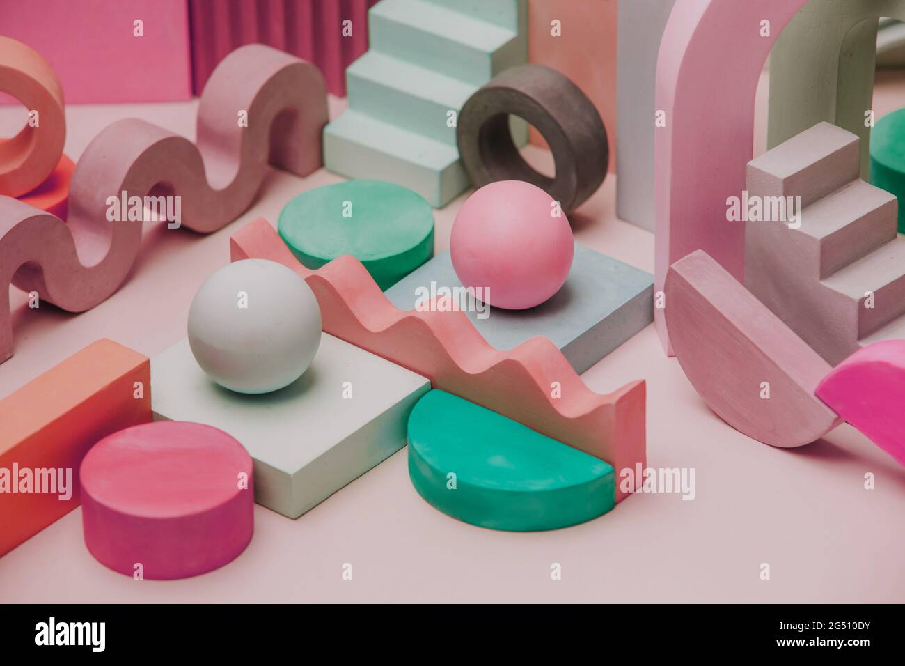 Assortment of wooden geometric figures in pastel colours Stock Photo ...