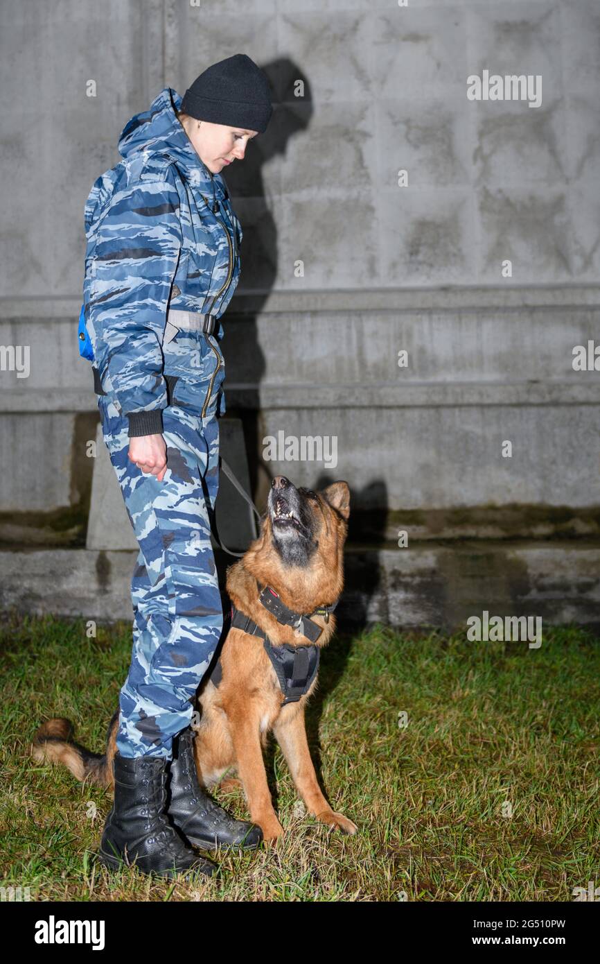 Female police officers with a trained dog. German shepherd police dog Stock Photo - Alamy