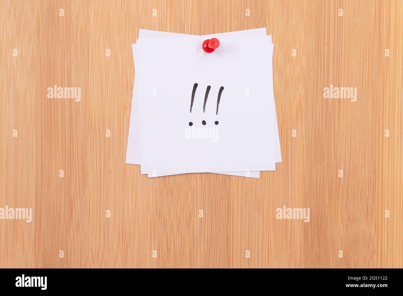 White Sticky Notes with Three Exclamation Points Pinned to the Wooden ...
