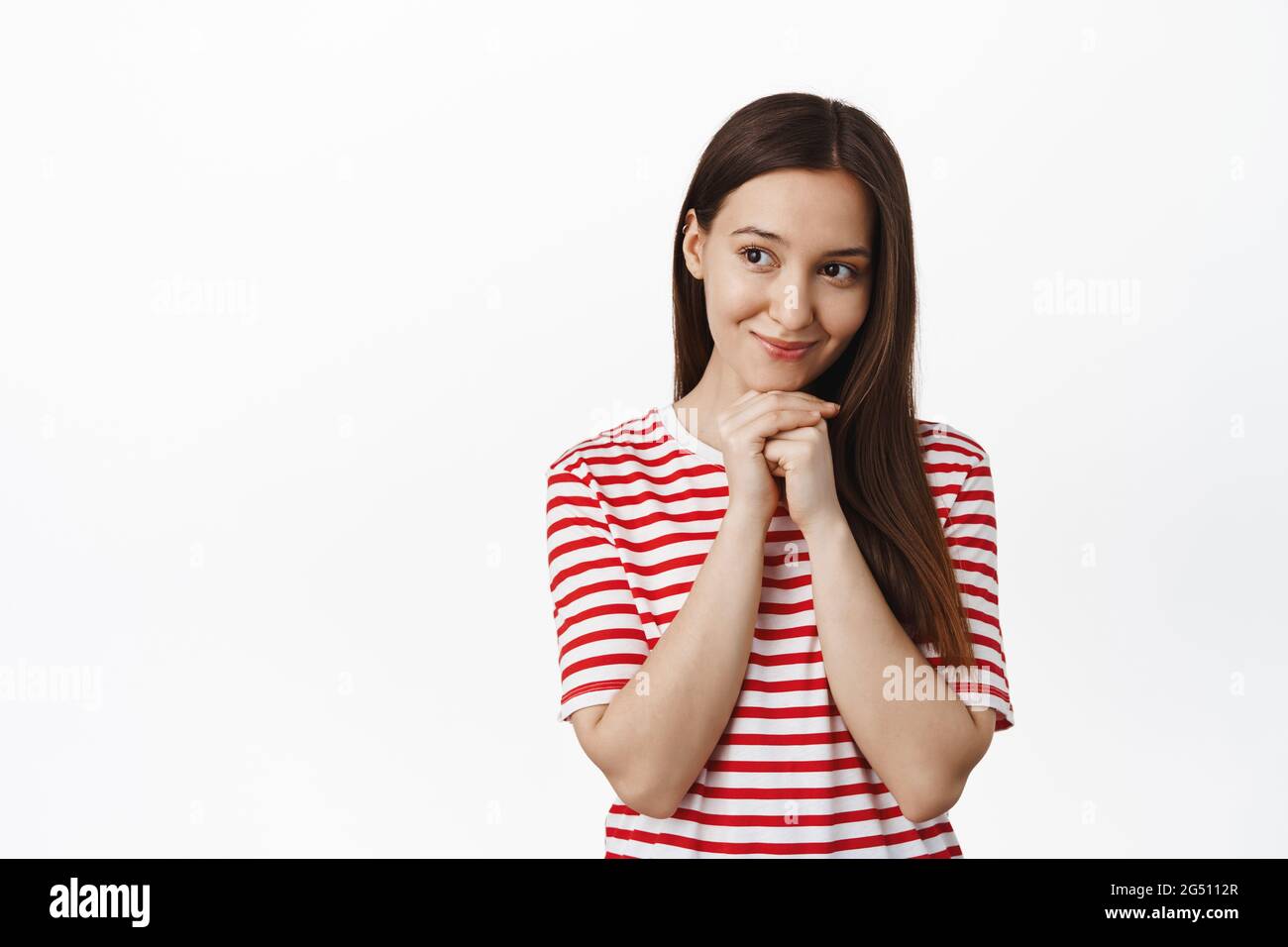 Cute woman contemplate smth adorable, looking aside with romantic ...