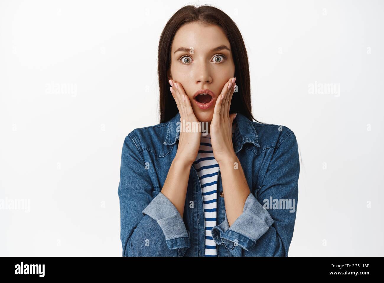 Close up of shocked adult woman gasp, stare startled and speechless at ...