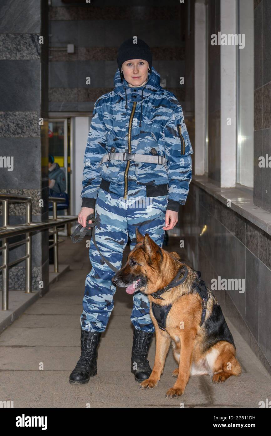 Female police officers with a trained dog. German shepherd police dog Stock Photo - Alamy