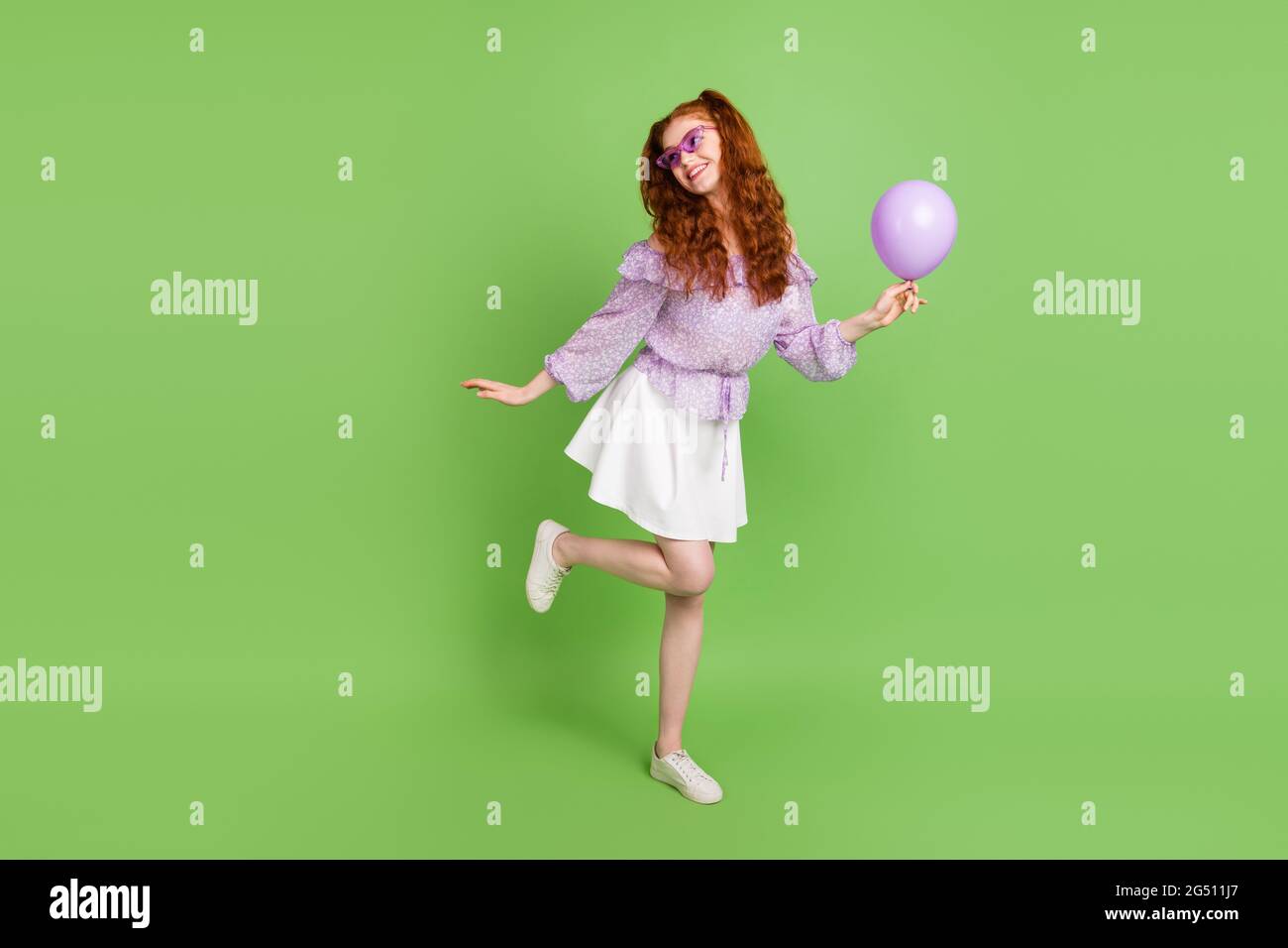 Full body photo of cute red hairstyle young lady hold balloon look ...