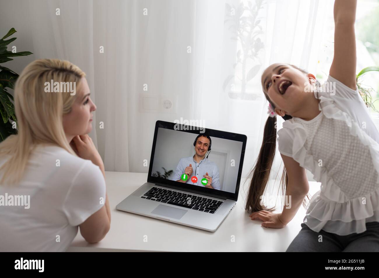 Online education of children. Mother and daughter of preschool watching ...