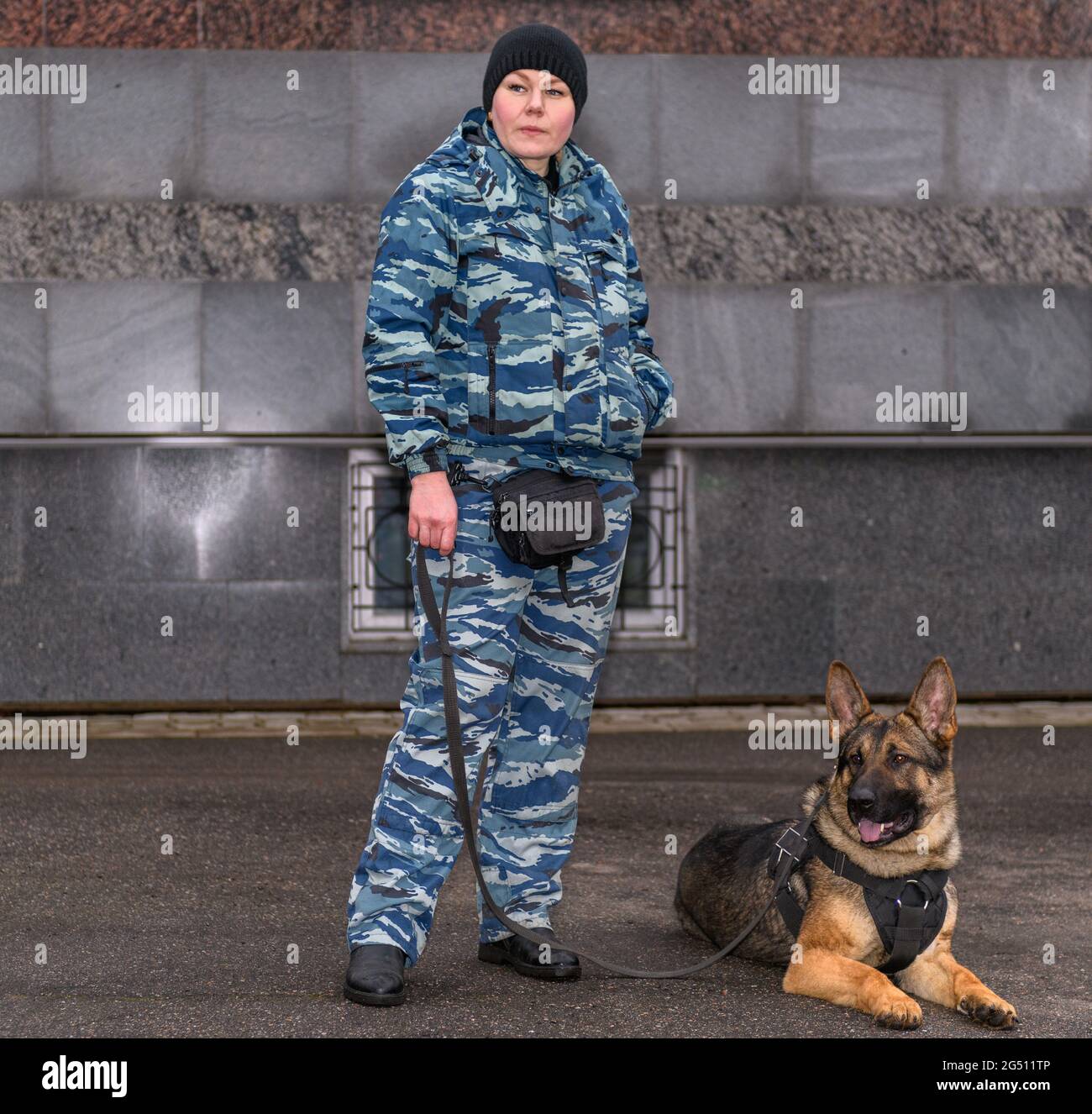 Female police officers with a trained dog. German shepherd police dog Stock Photo - Alamy