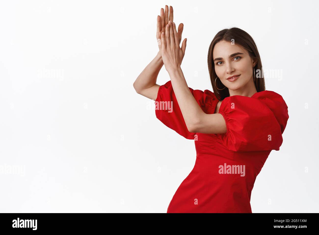 Gorgeous young hispanic woman dancing hot and sensual flamenco dance ...