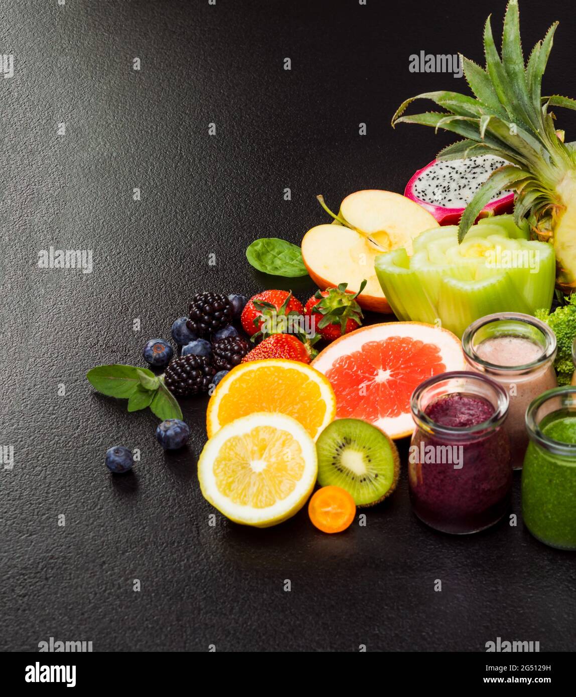 Group of different fruit smoothies in glasses various vegetables and ...