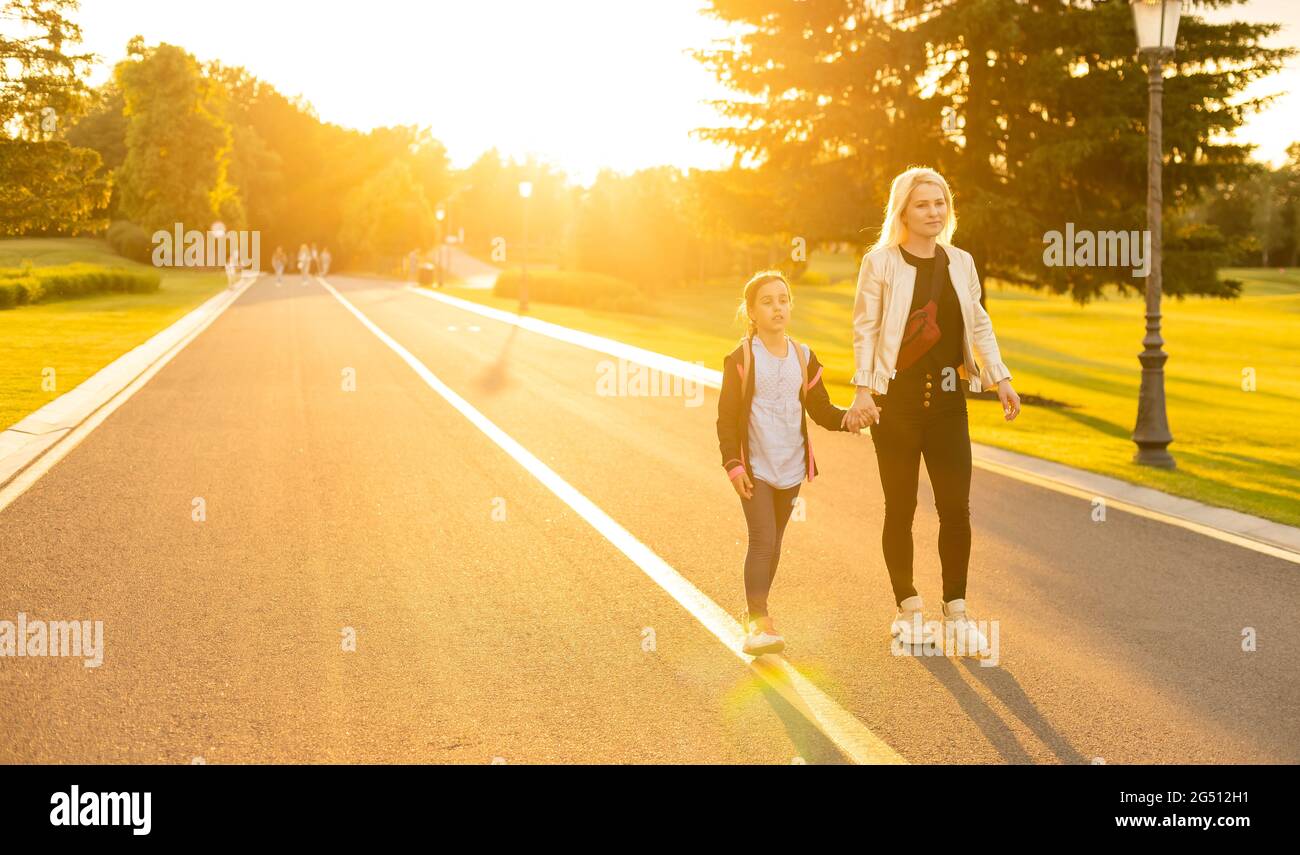 Parent taking child to school Stock Photo - Alamy