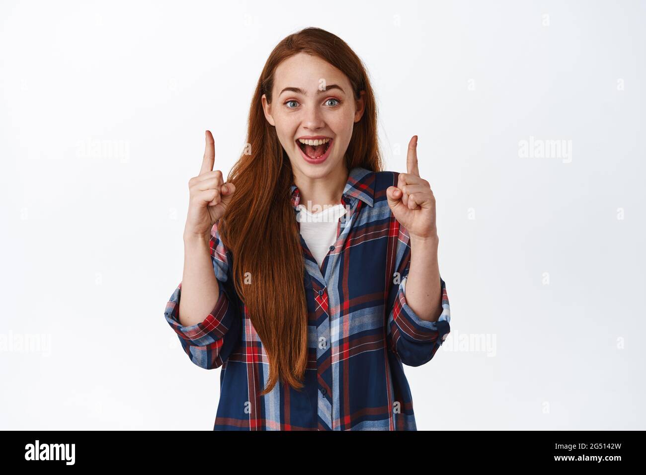 Look Up Excited Ginger Girl Scream And Pointing At Fantastic Logo