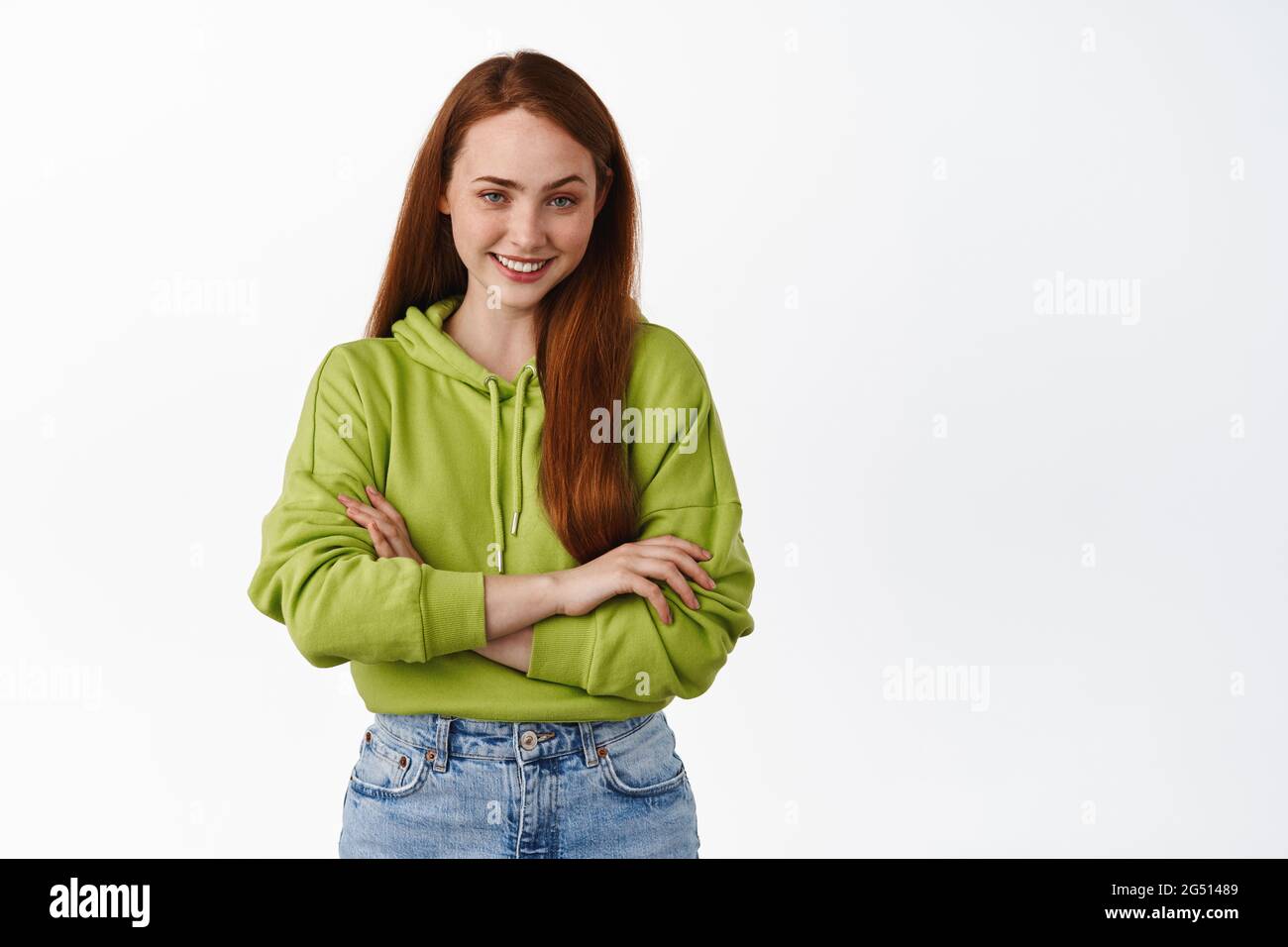 Confident and sassy redhead caucasian woman, cross arms on chest self ...