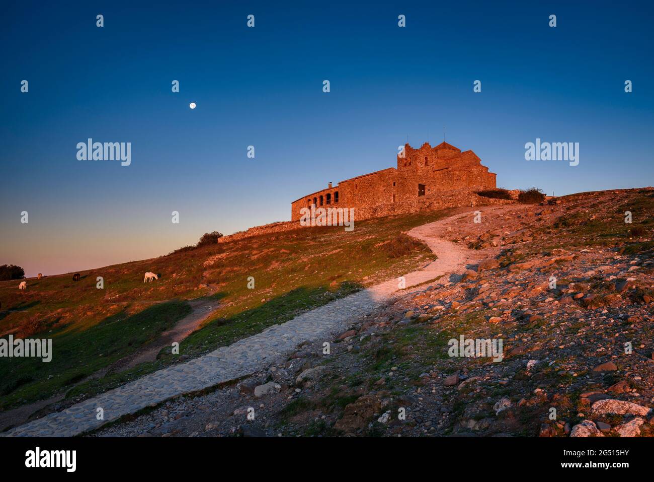 Sant Llorenç del Munt monastery at sunrise with the full moon (Vallès ...