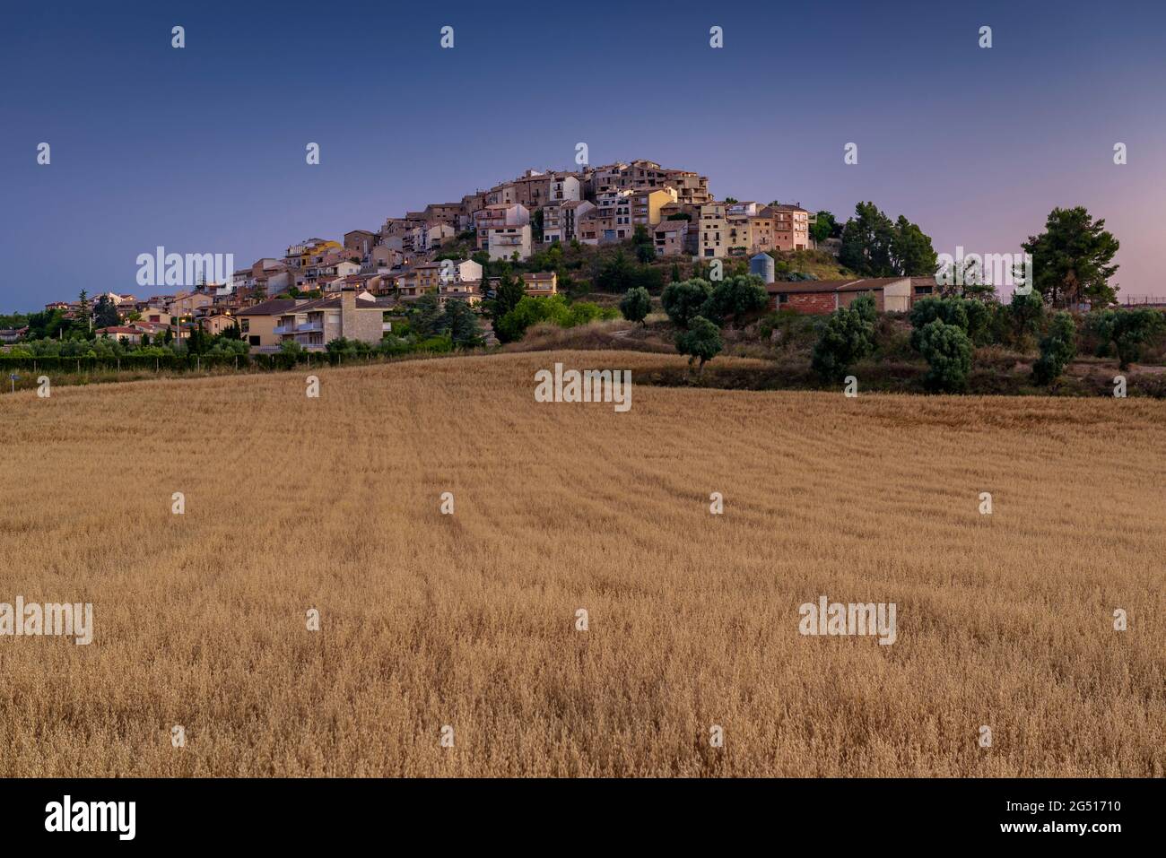 Sunrise over Horta de Sant Joan village and the surrounding crop fields ...