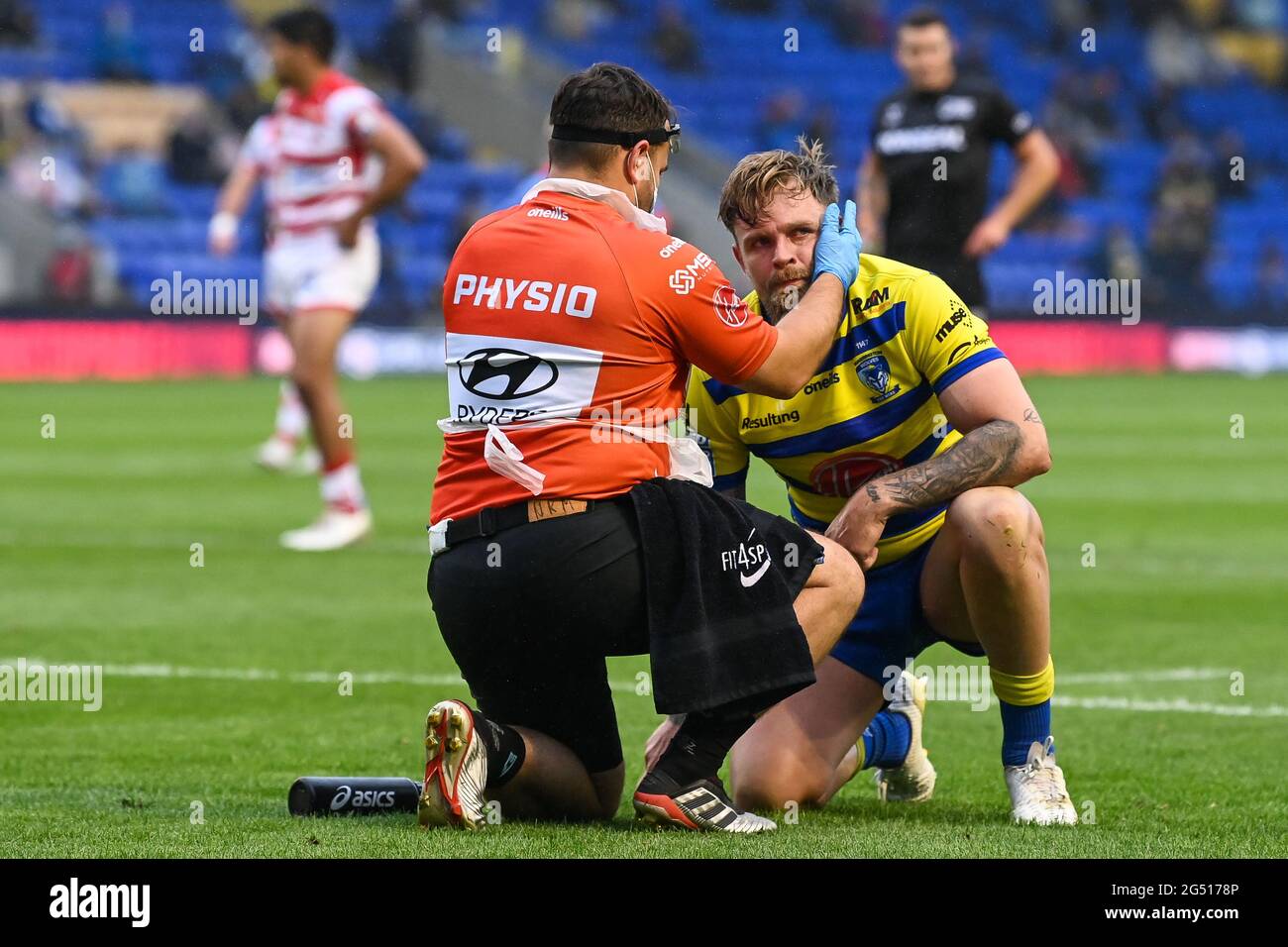 Blake Austin (6) of Warrington Wolves receives treatment in, on 6/24 ...