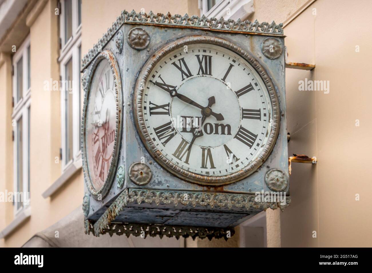 Ebeltoft, Denmark - 20 July 2020: Old antique clock hanging on a yellow ...