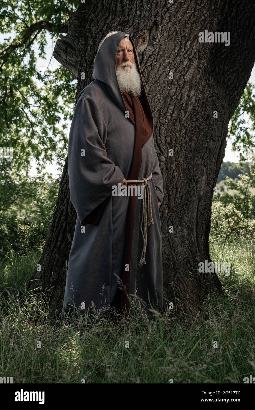Portrait of a Monk in a black cassock in the forest, a wandering druid ...
