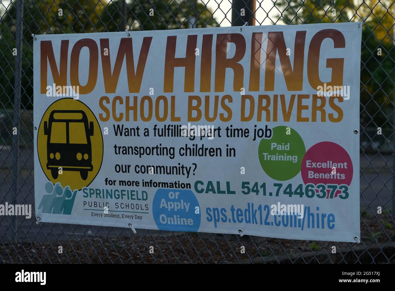 A Now Hiring School Bus Drivers sign at Springfield High School ...
