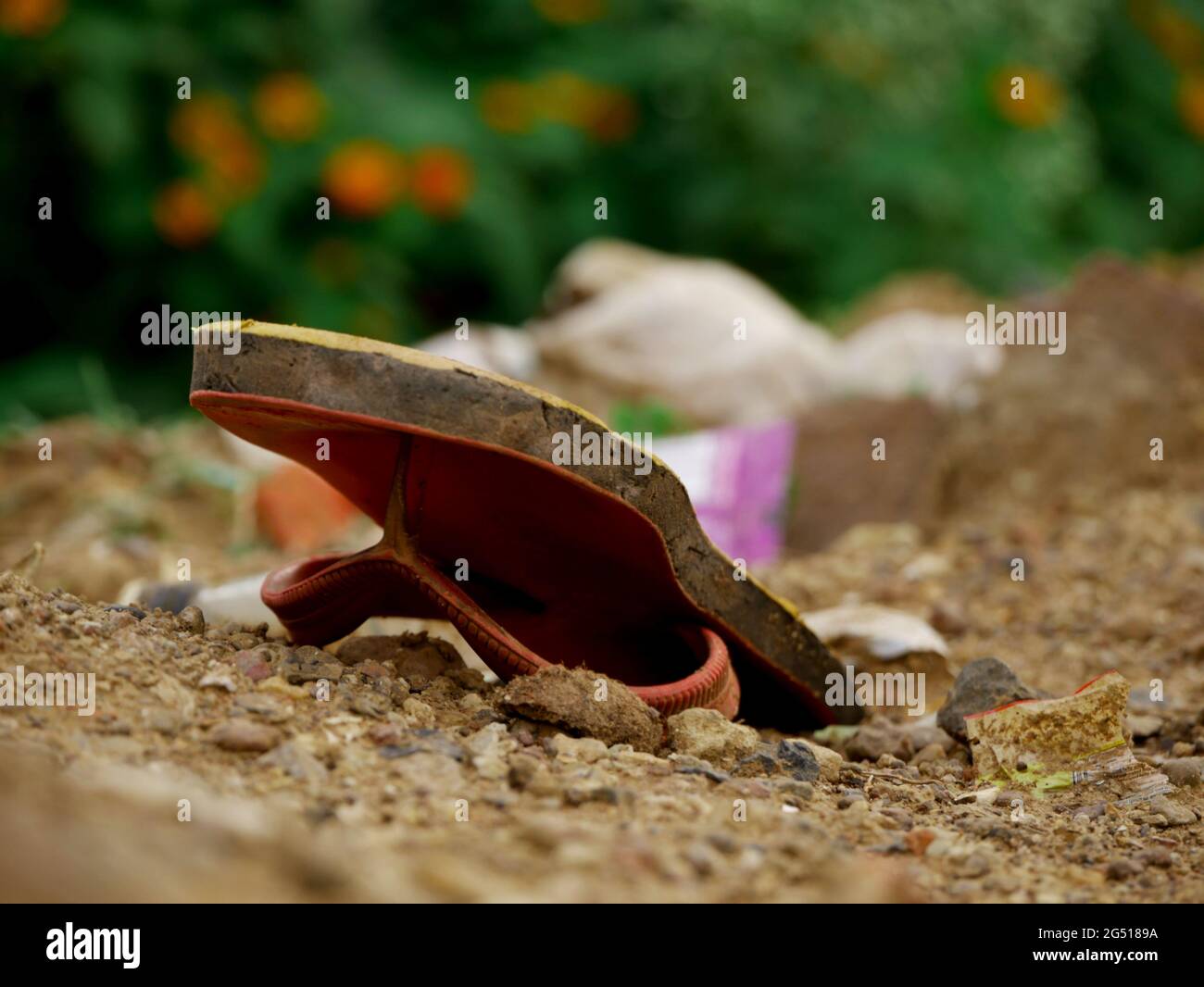 Old used foot sleeper lying on soil field, missing people concept Stock ...