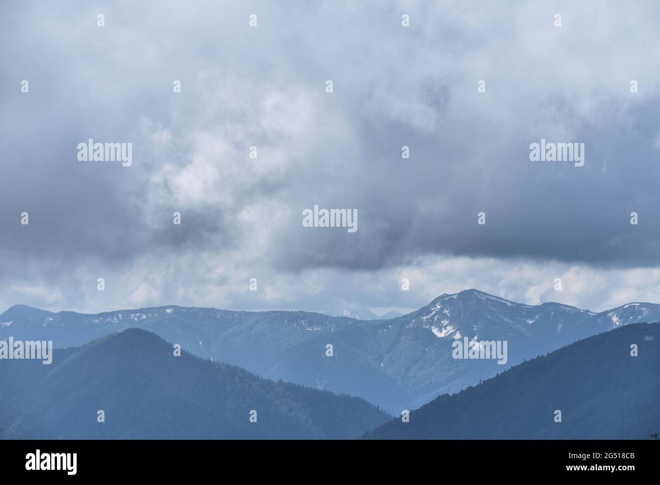 Beautiful panorama of several Caucasian mountains located on ridge. Low ...