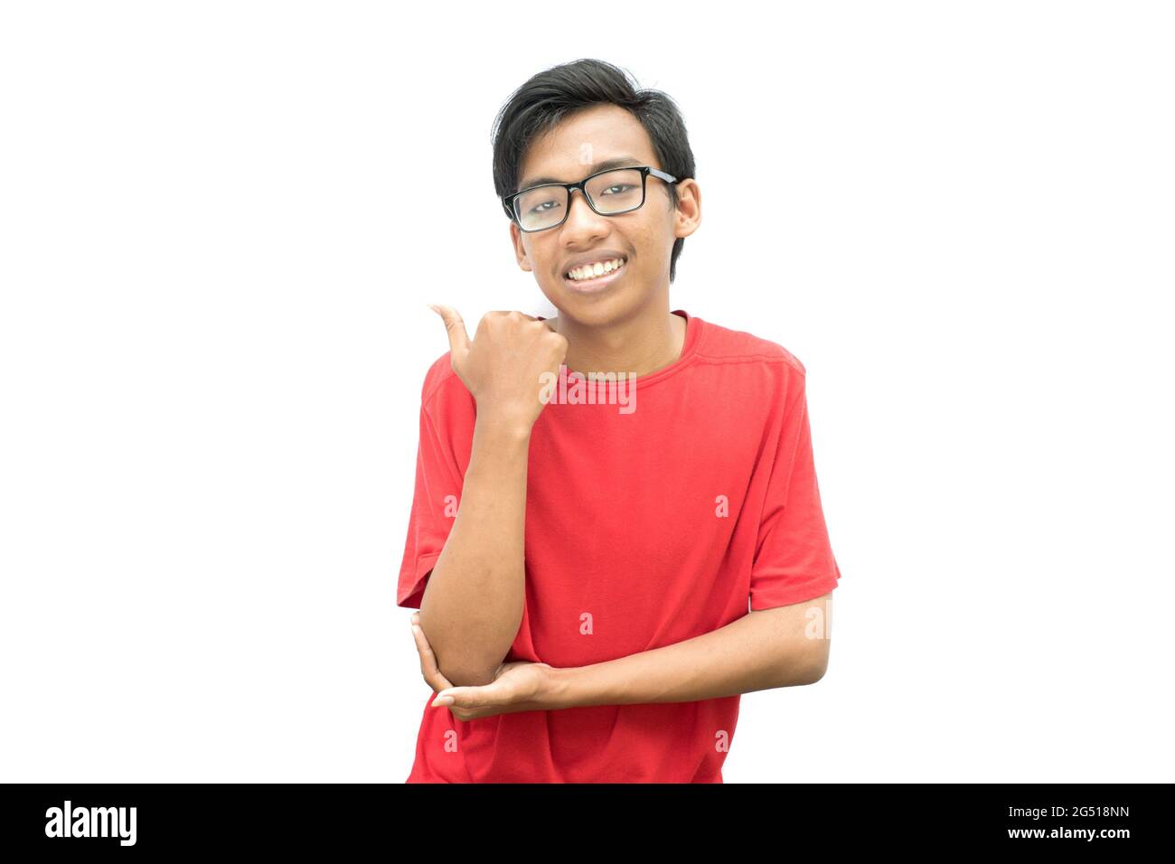 Happy smiling Indonesian guy wearing a red t-shirt and eyeglasses ...