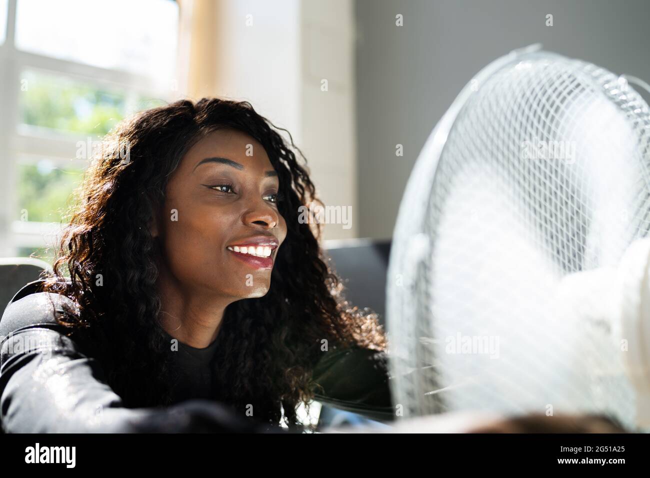 Electric fan woman hi-res stock photography and images - Alamy