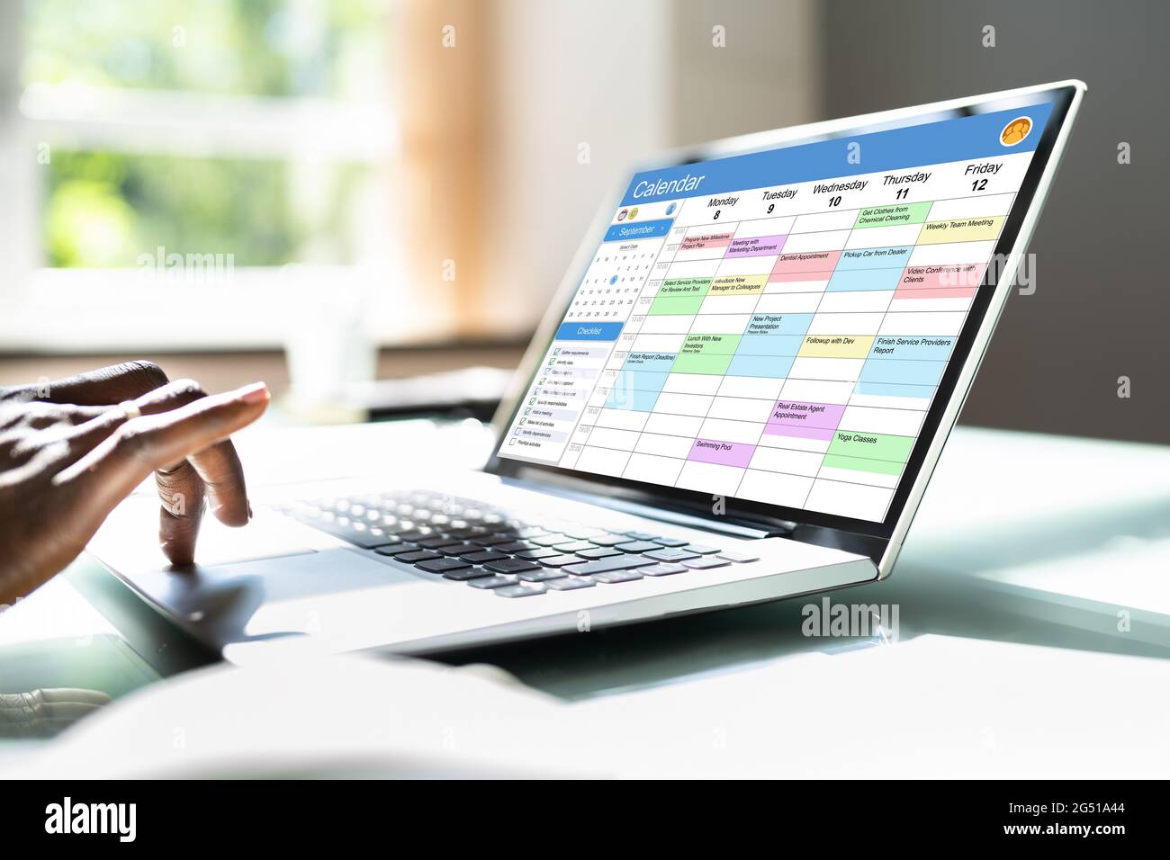 Executive Using Digital Calendar Agenda On Hybrid Laptop Stock Photo ...