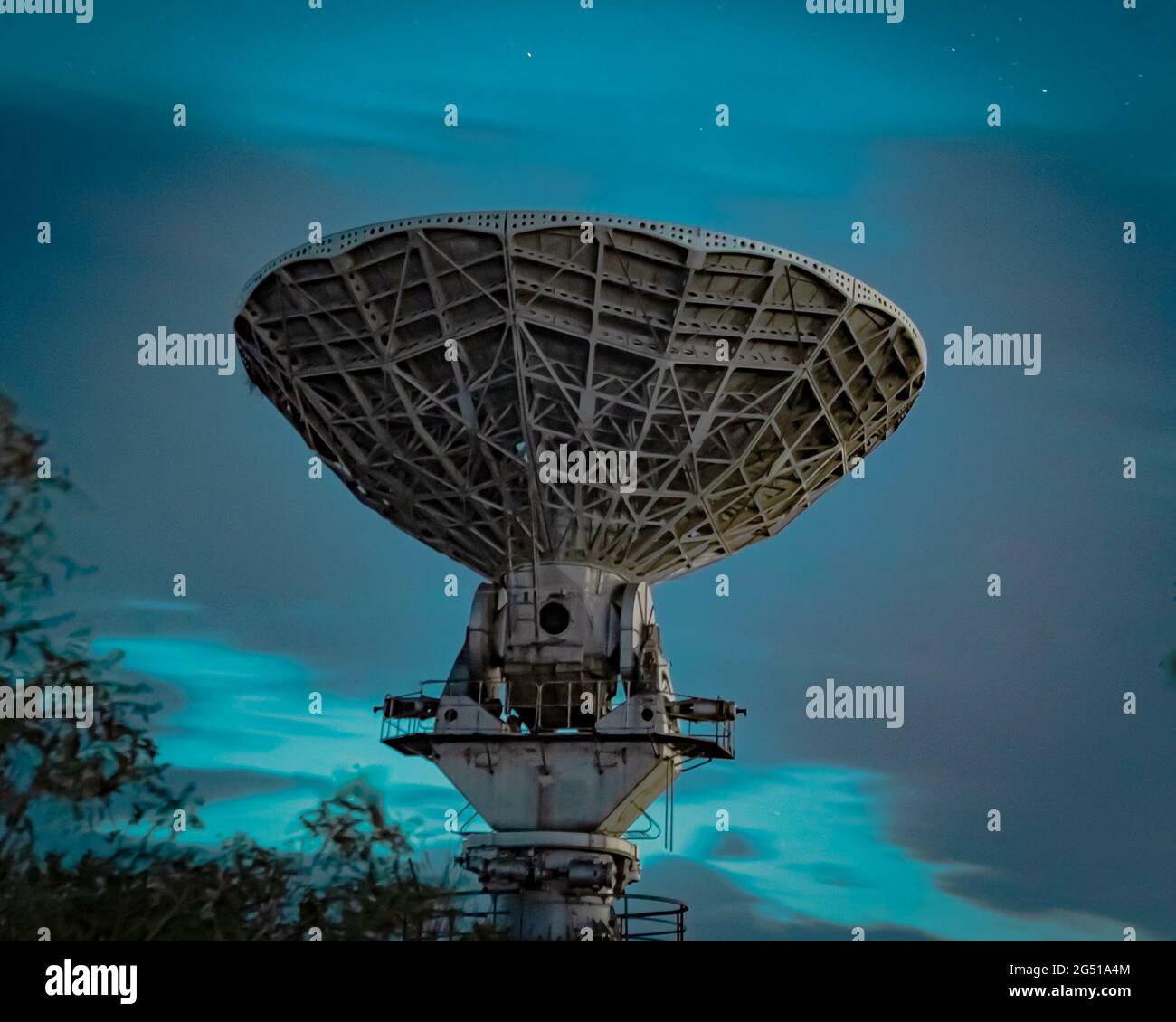 Stunning view of a large array radio telescope against a green sky ...